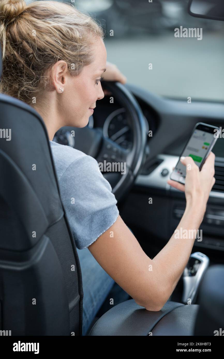 Woman steering wheel reading hi-res stock photography and images - Alamy