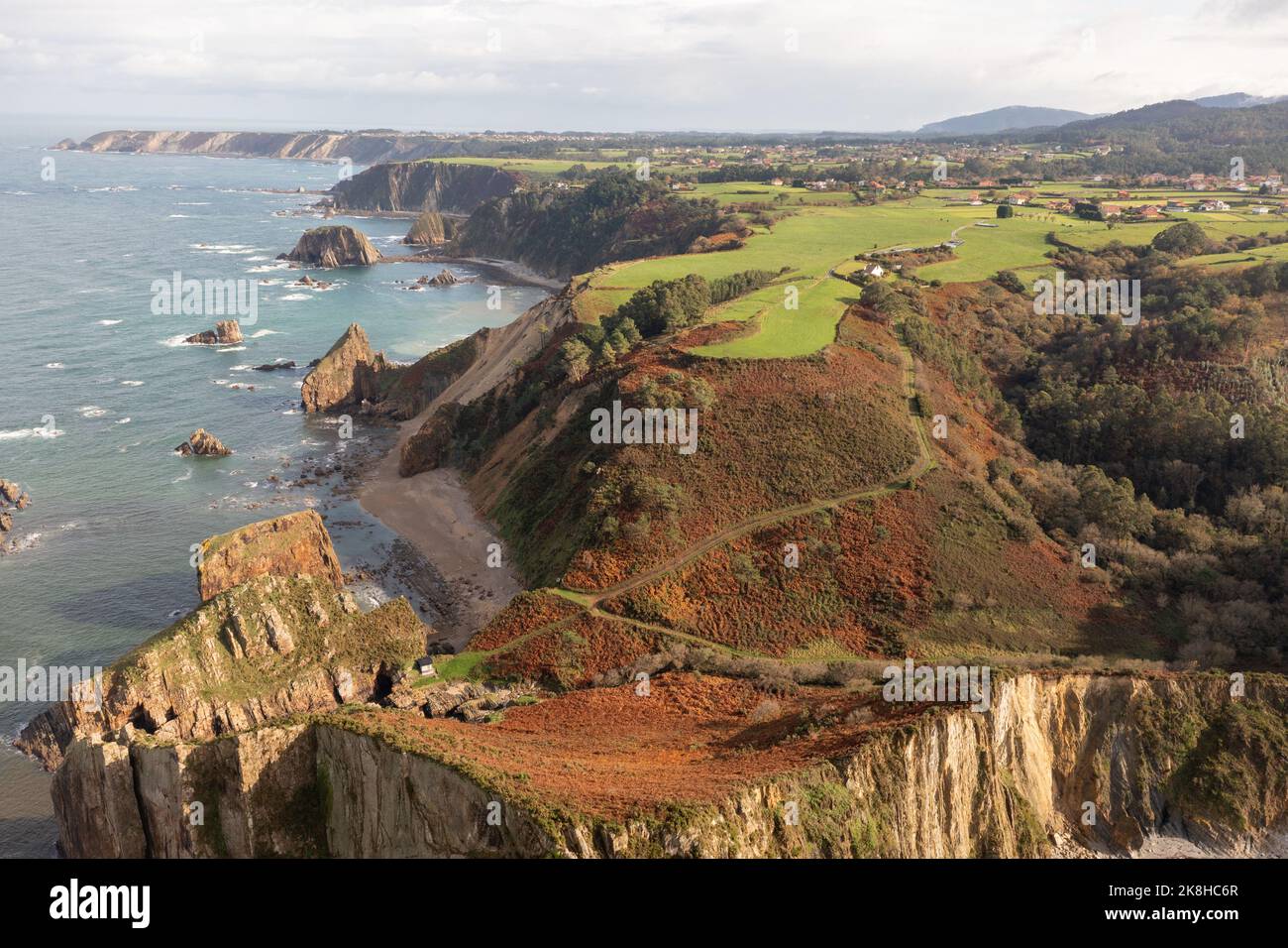 Silence beach, silver-sandy cove backed by a natural rock amphitheatre ...