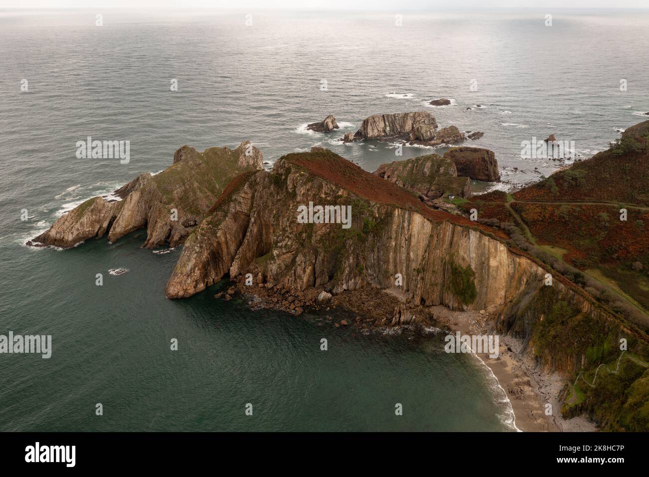Silence beach, silver-sandy cove backed by a natural rock amphitheatre ...
