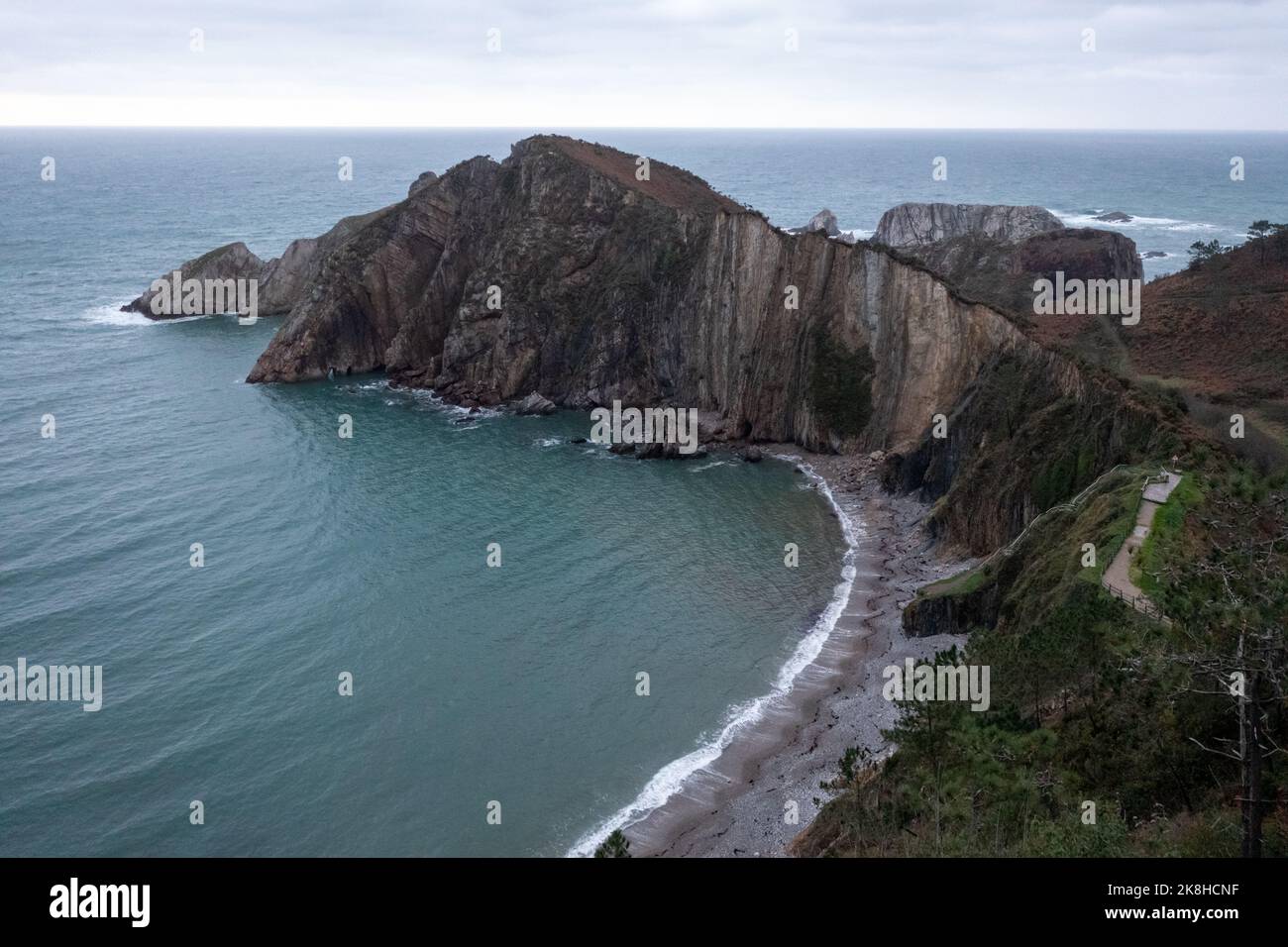 Silence beach, silver-sandy cove backed by a natural rock amphitheatre ...