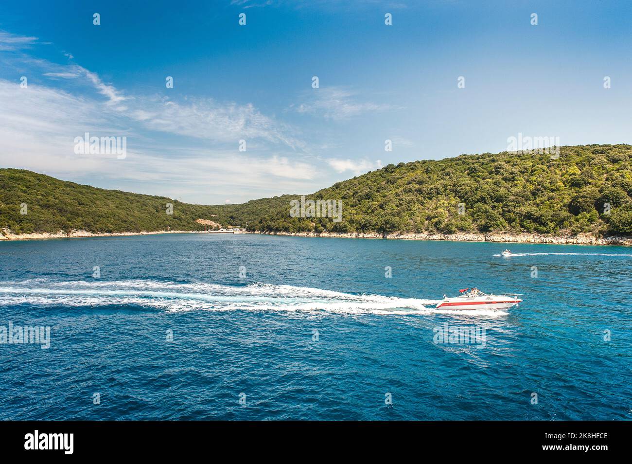 Speedboat passing a Cove/bay in the Adriatic coast of Croatia ...