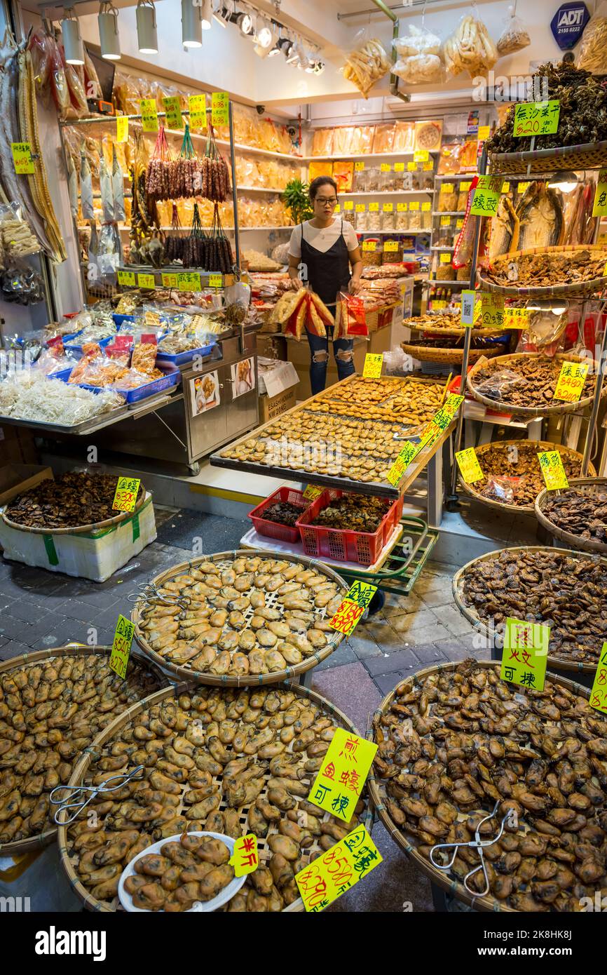 Dried mussels on display, and other seafood for sale, in a shop in Yuen ...