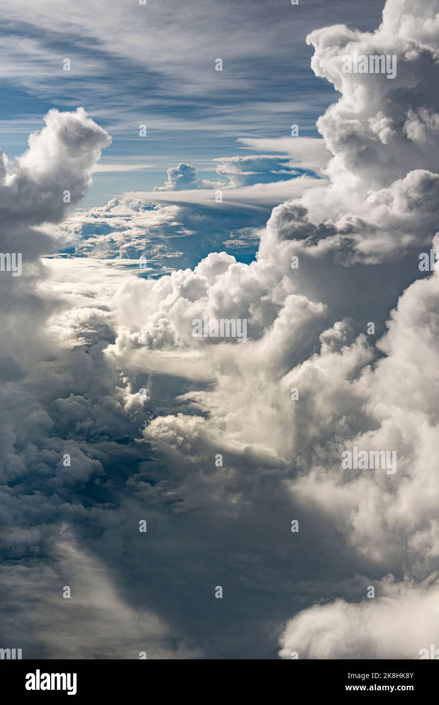 A complex mix of cumulonimbus, altostratus and cirrus clouds over the ...