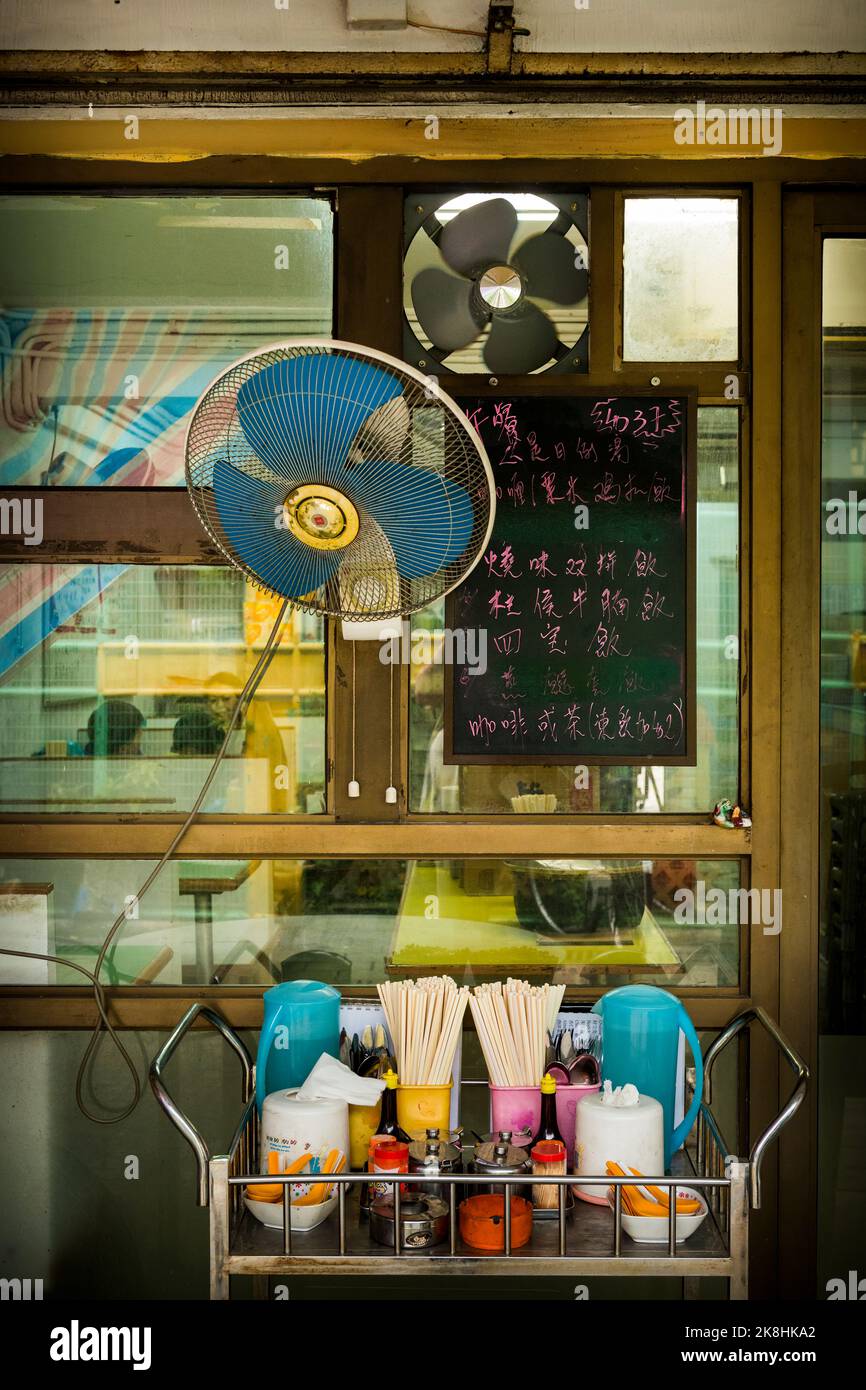 A cart of utensils and items to set up two tables outside a traditional ... A cart of utensils and items to set up two tables outside a traditional ...