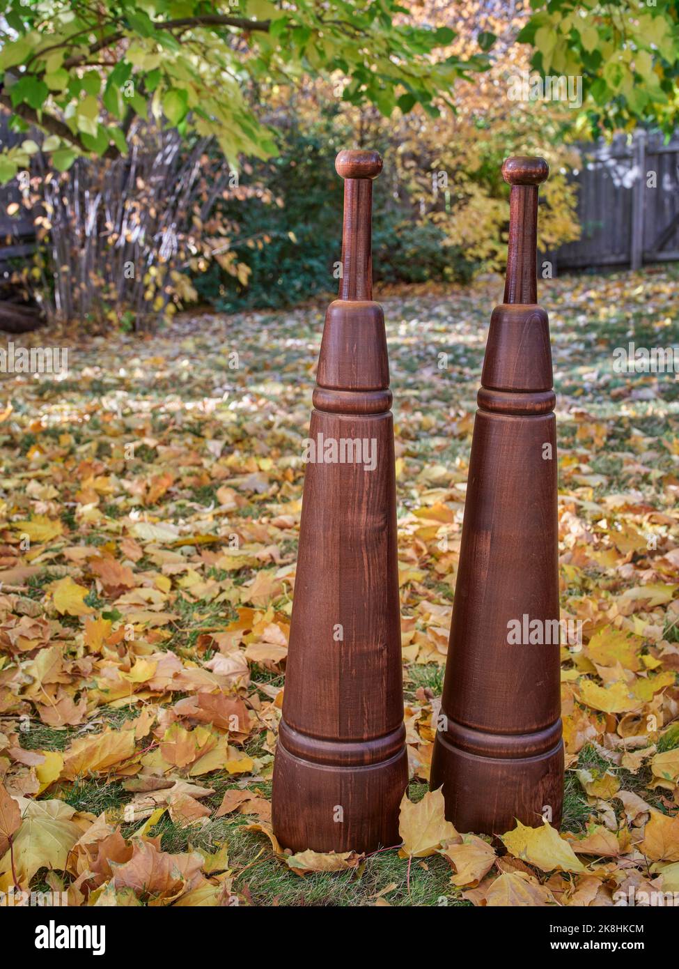 A couple of traditional wooden Persian meels in a backyard in fall ...