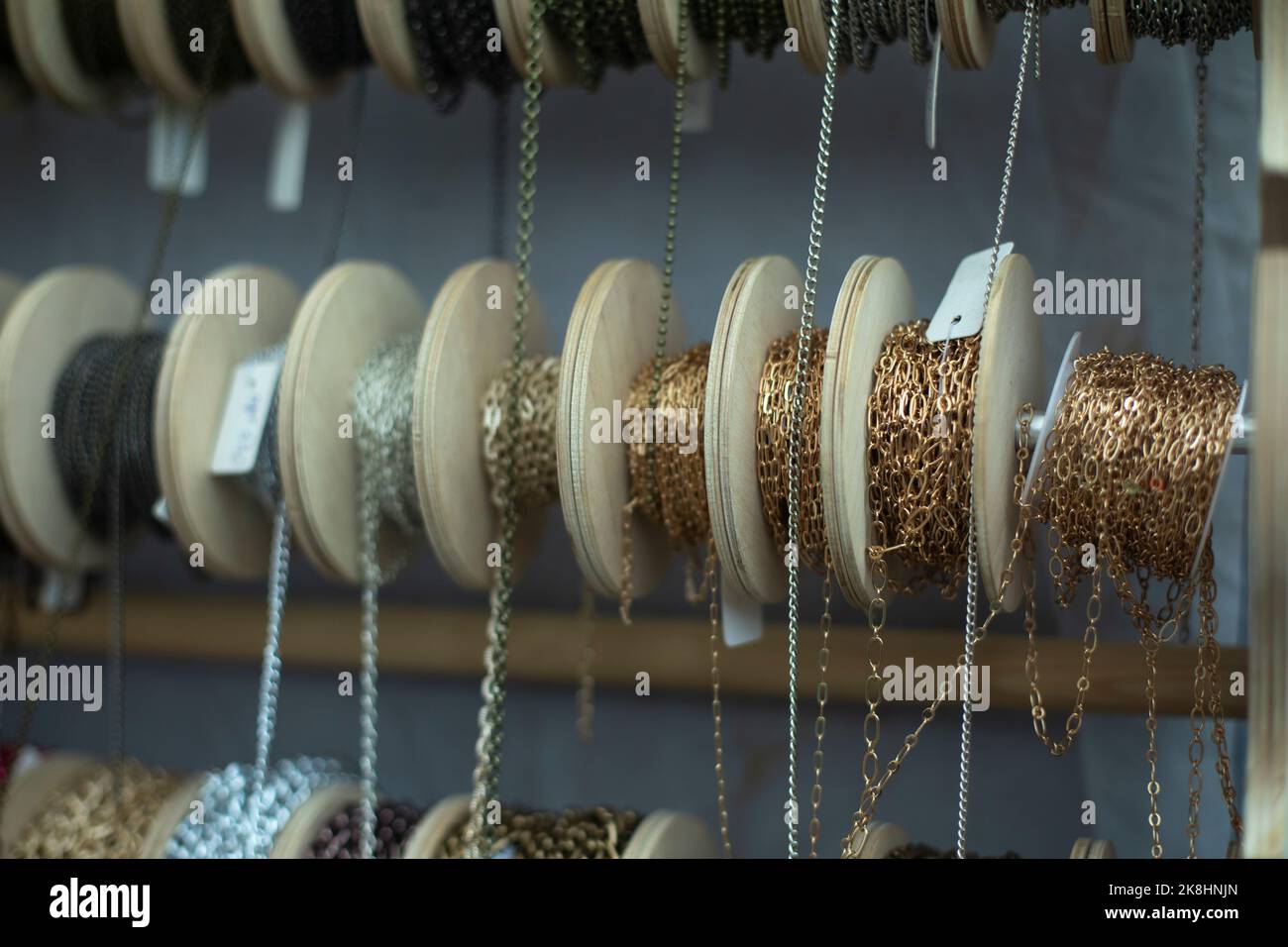 Chain decoration on coils. Sale of jewelry. Chains wound on reels ...