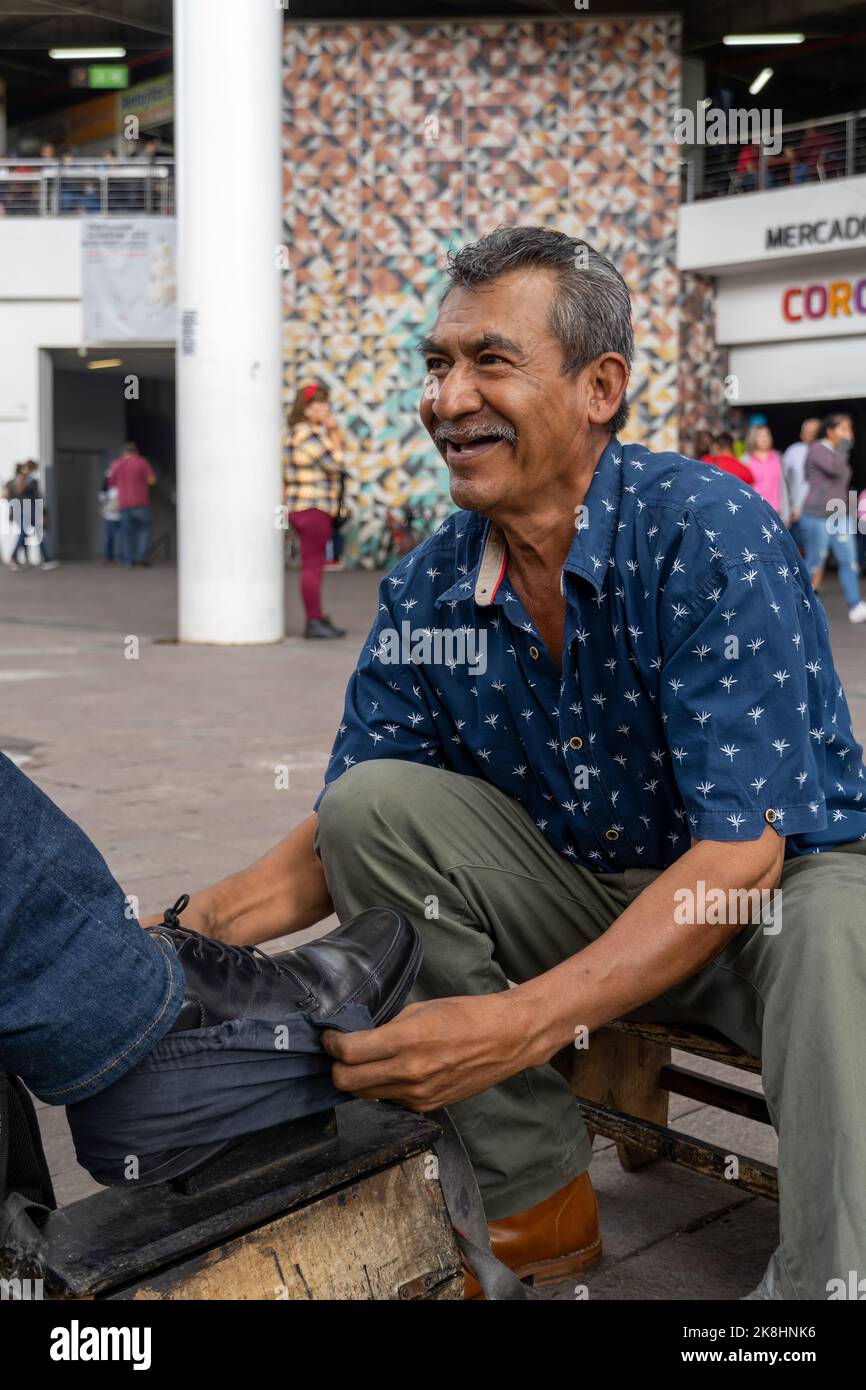 shoes in a wash basin with soapy water. cleaning the shoes at street ...