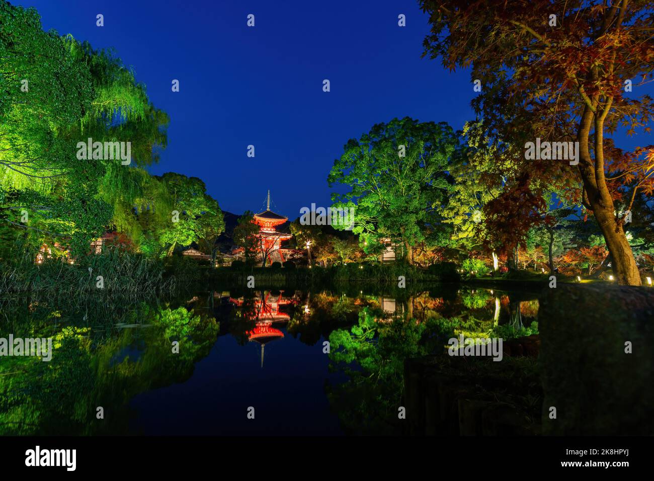 Night view of the Shingyo-Hoto Tower with reflection in Daikaku Ji at ...