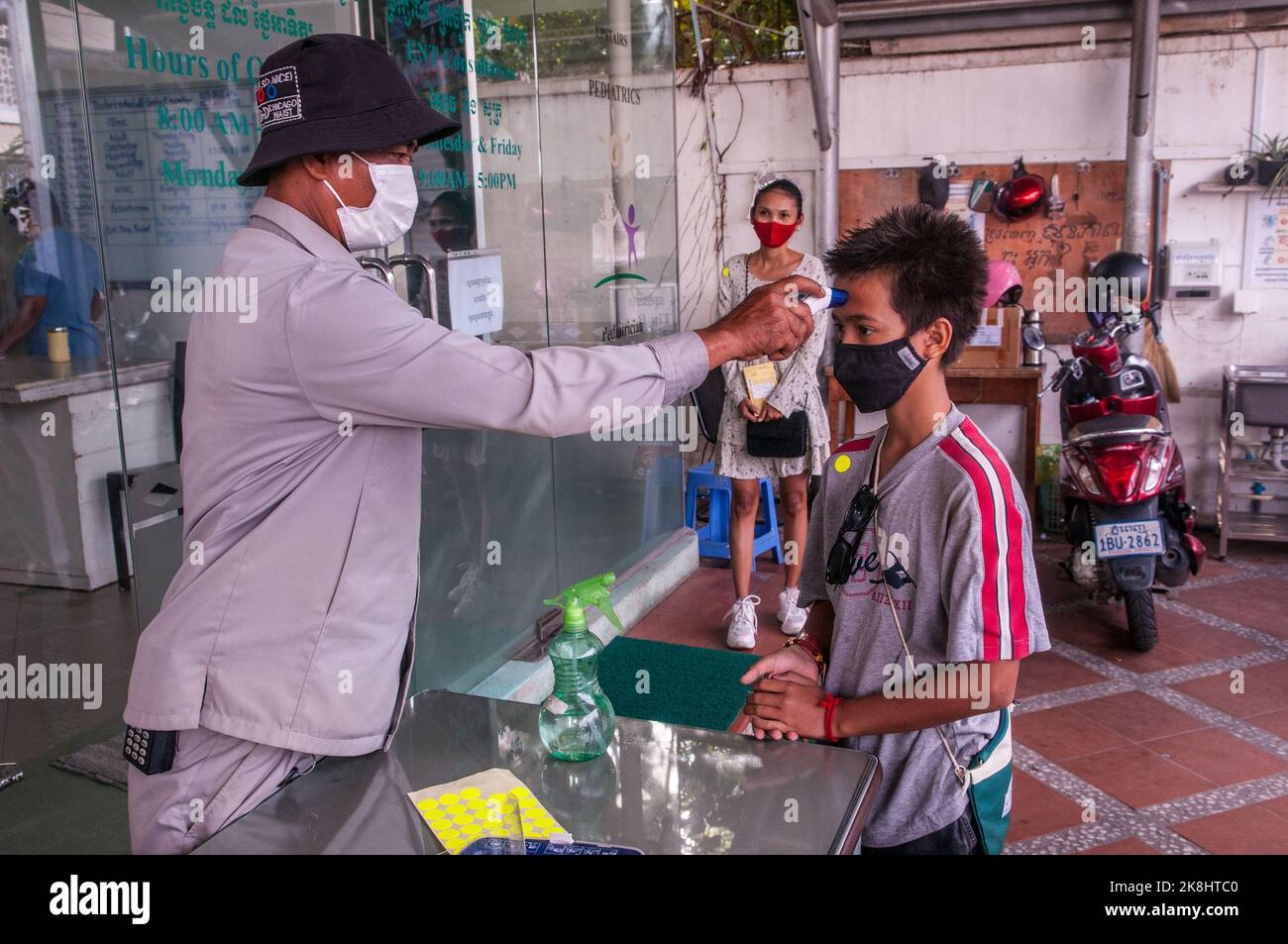 during an outbreak of COVID - 19, a mixed race teenage boy (Cambodian ...