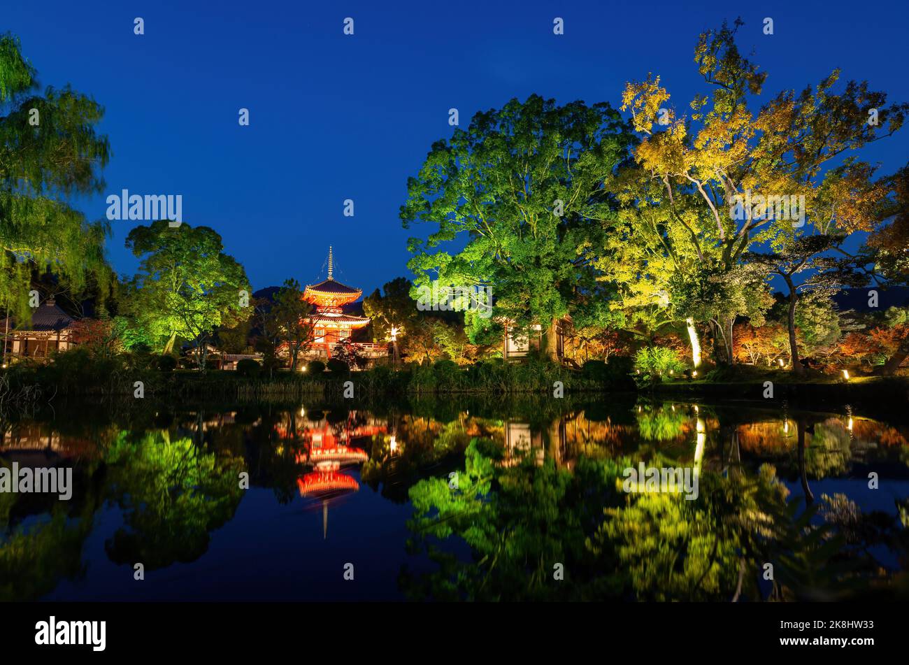 Night view of the Shingyo-Hoto Tower with reflection in Daikaku Ji at ...