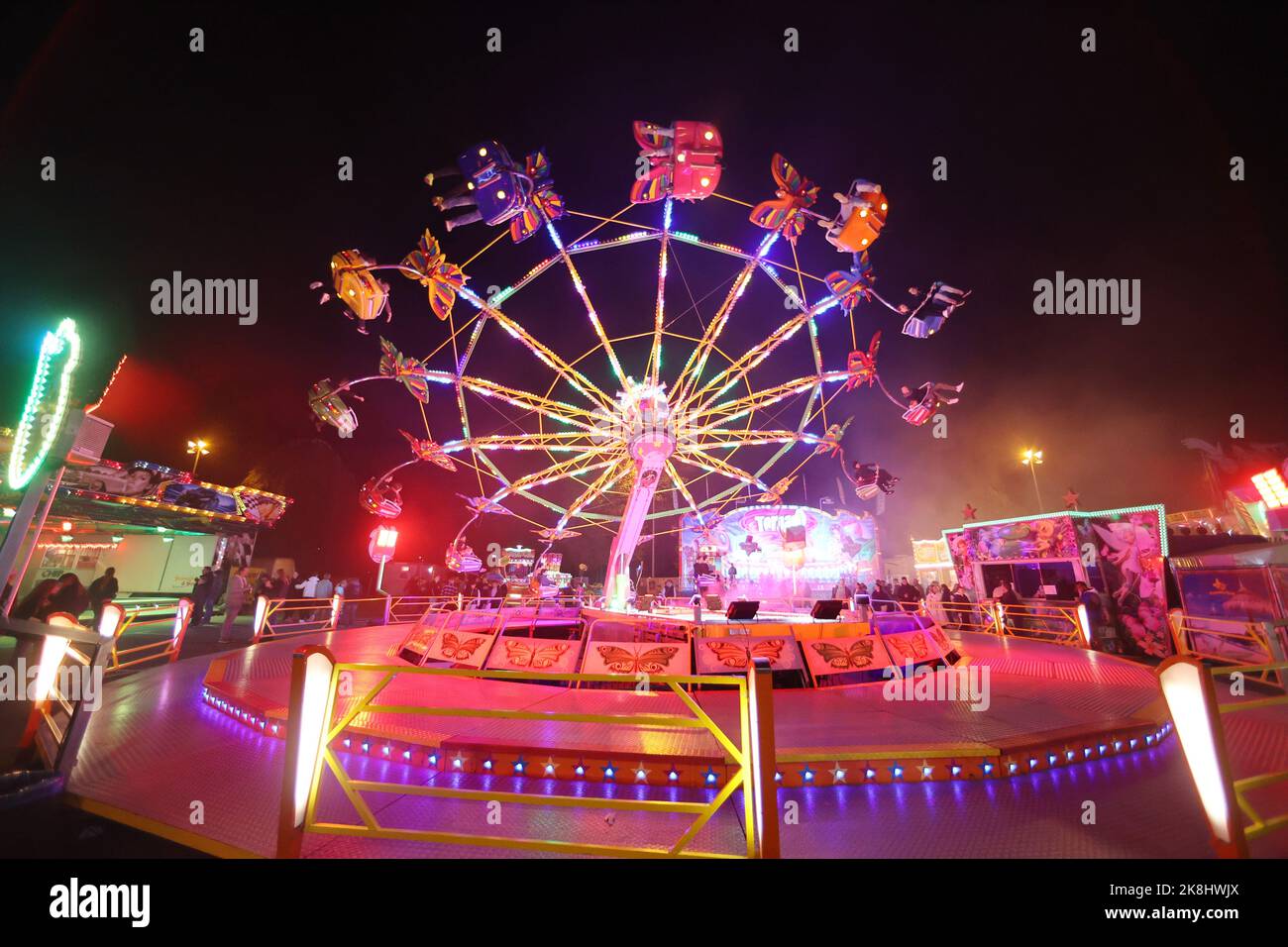 Gera, Germany. 19th Oct, 2022. The ride "Butterfly" turns colorfully ...