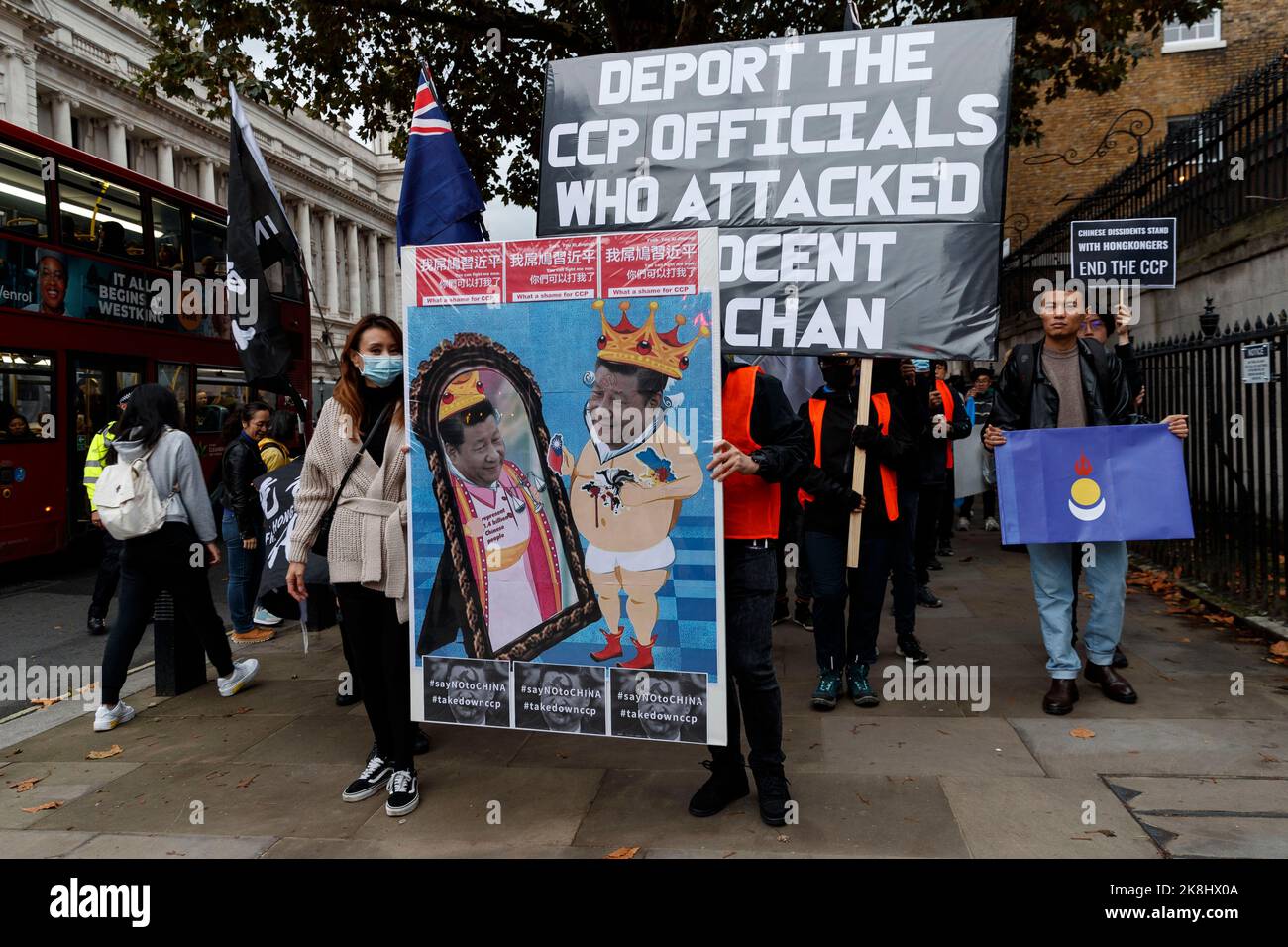 London, UK. 23rd Oct, 2022. Protesters hold flags and placards march to ...