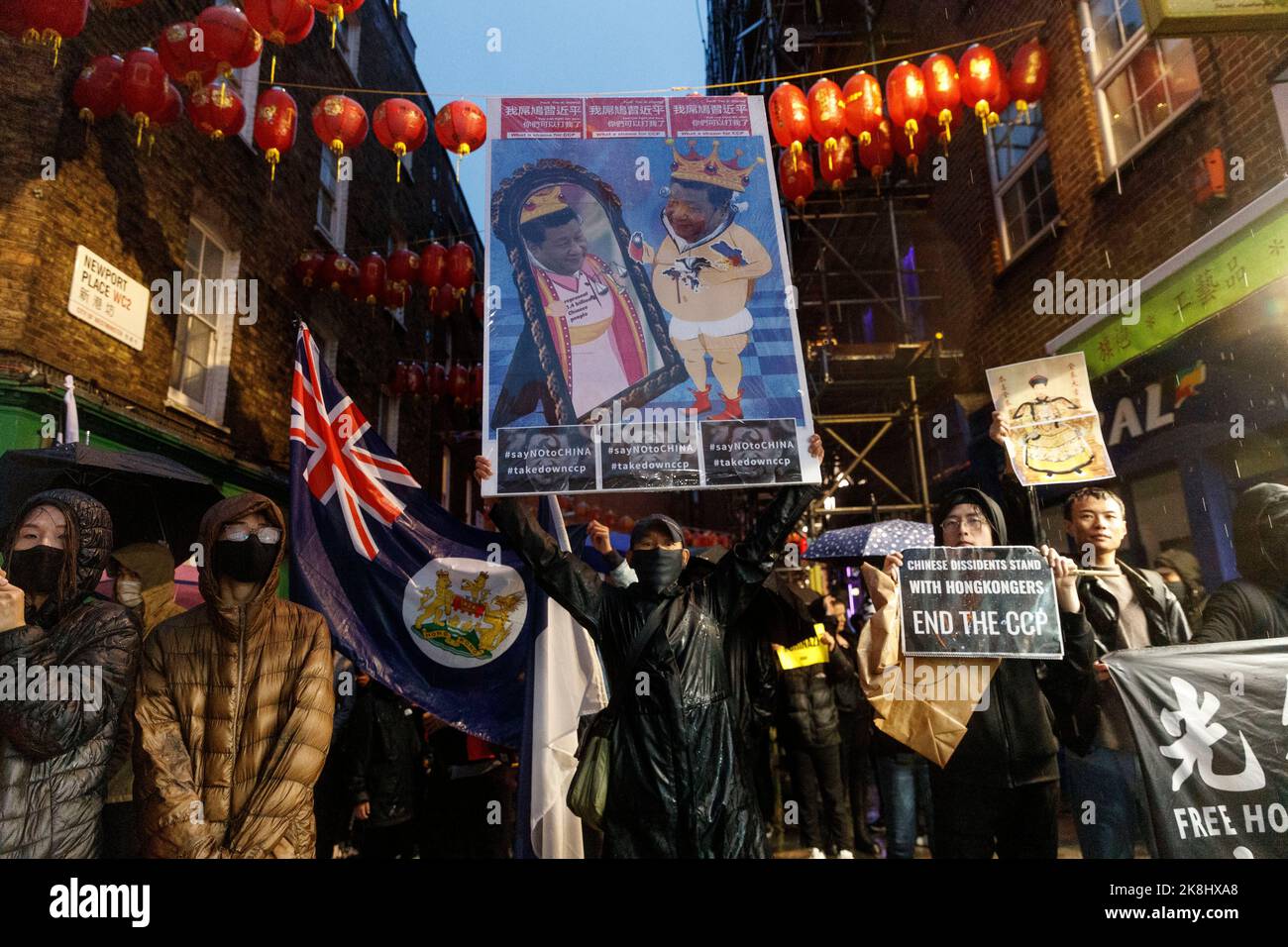 London, UK. 23rd Oct, 2022. Protesters hold British colonial flags and ...