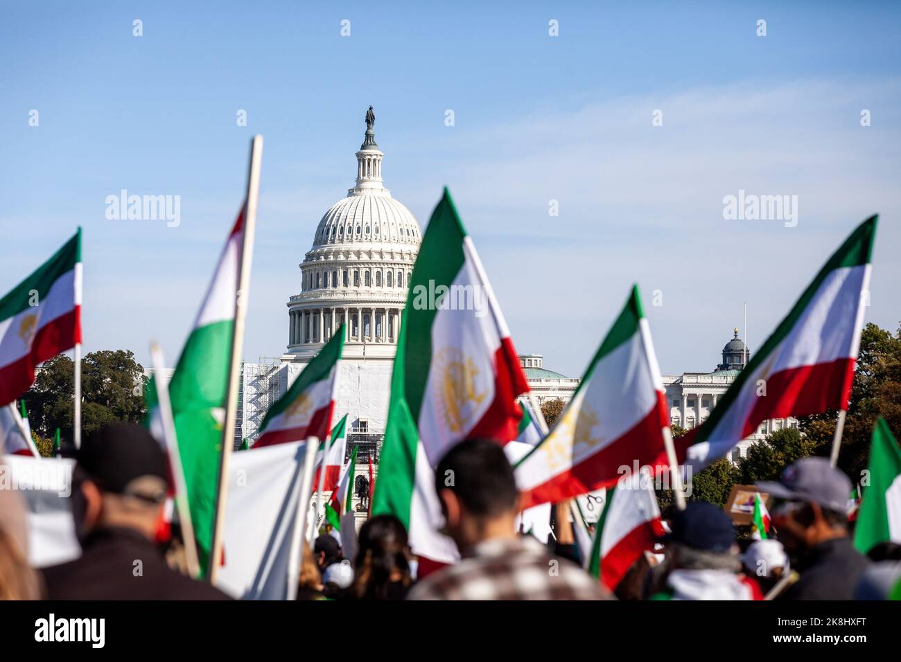 Demonstrators wave Iranian flags in front of the US Capitol during a ...