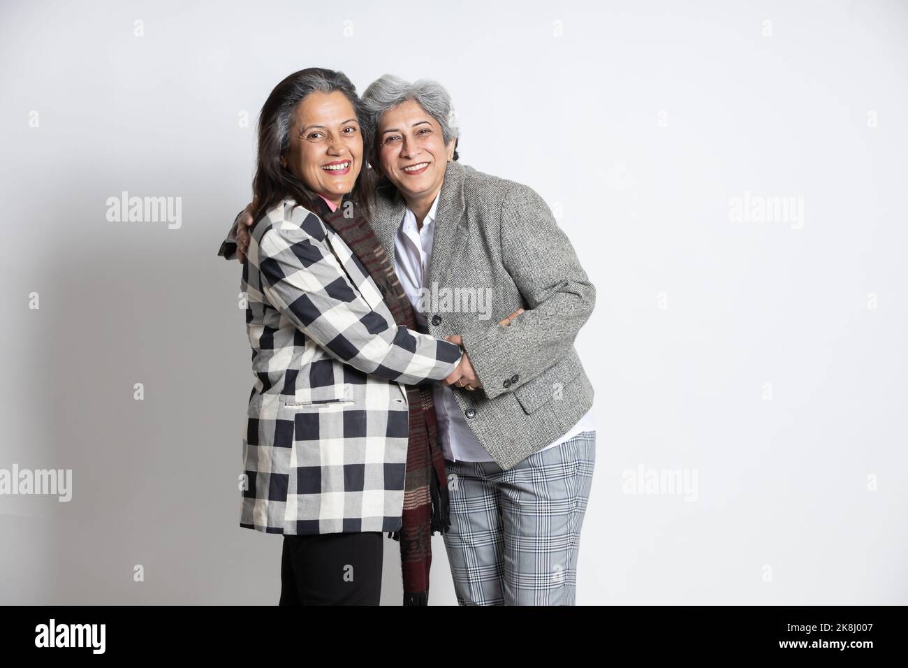 Portrait of two happy cheerful mature senior indian businesswoman ...