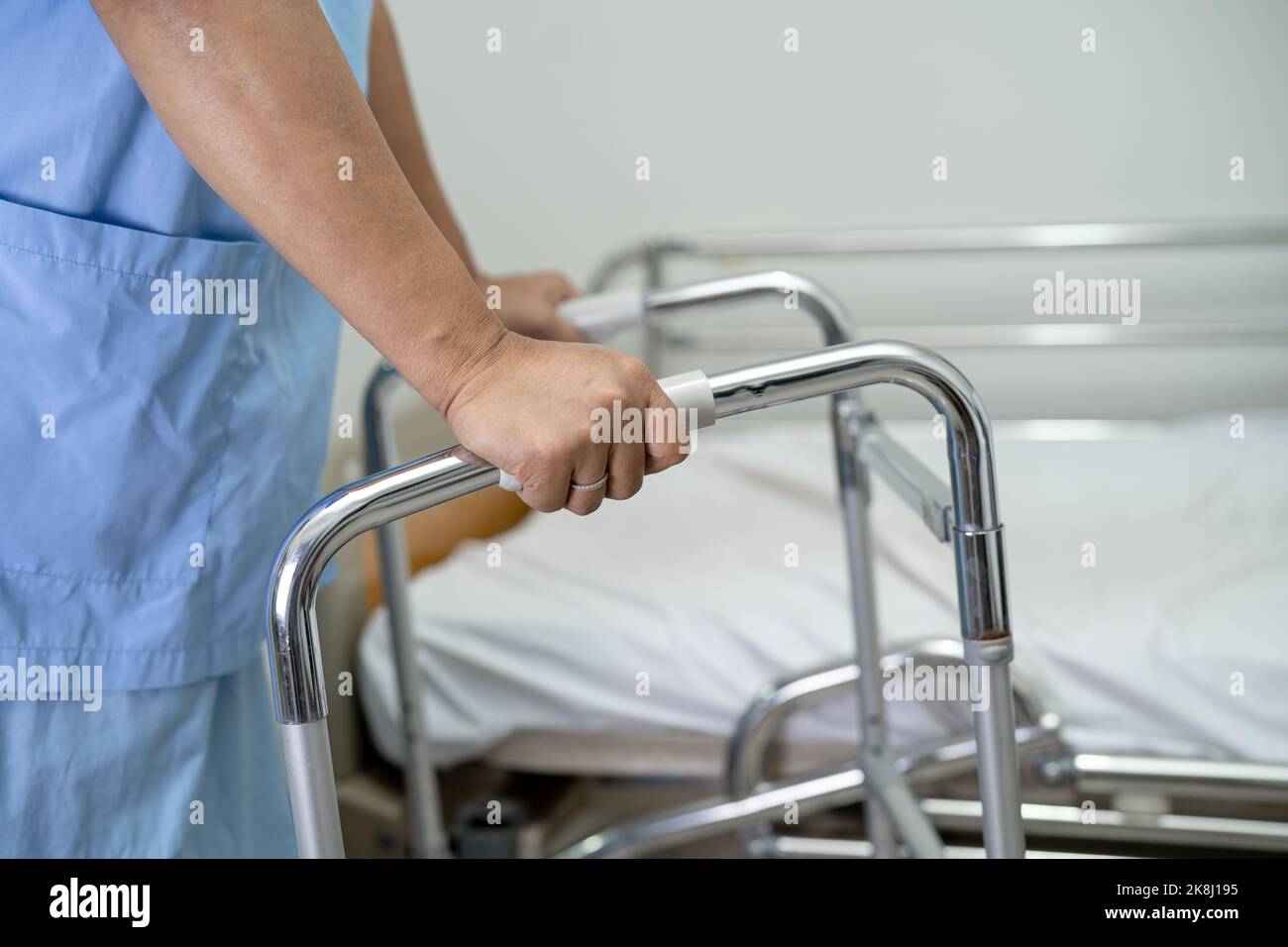 Asian lady woman patient walk with walker at nursing hospital ward ...