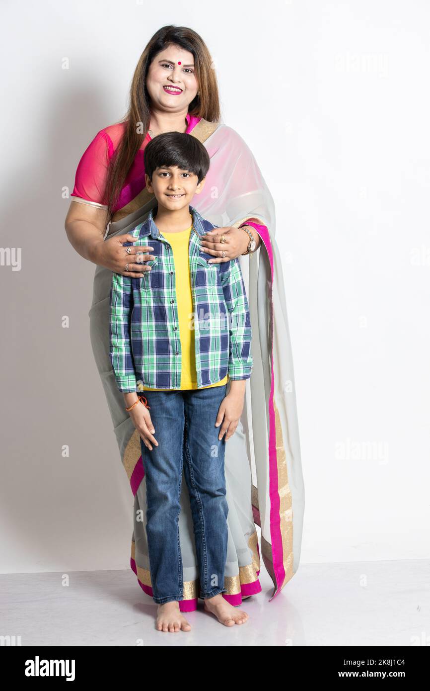 Portrait of happy indian mother and son hug looking at camera, Isolated ...