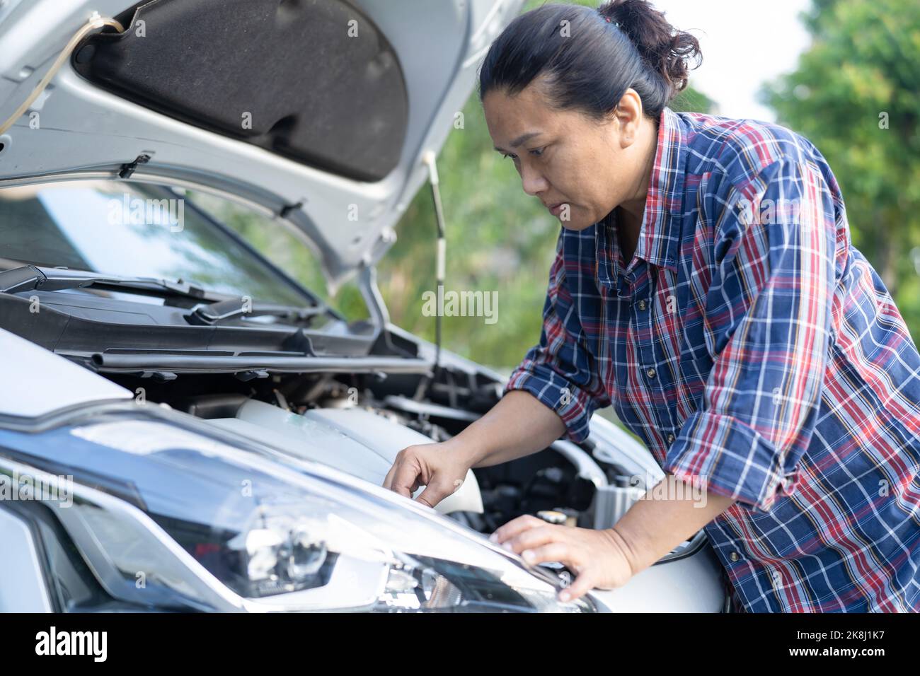 Open hood mechanic engine system to check and repair damage car crash ...
