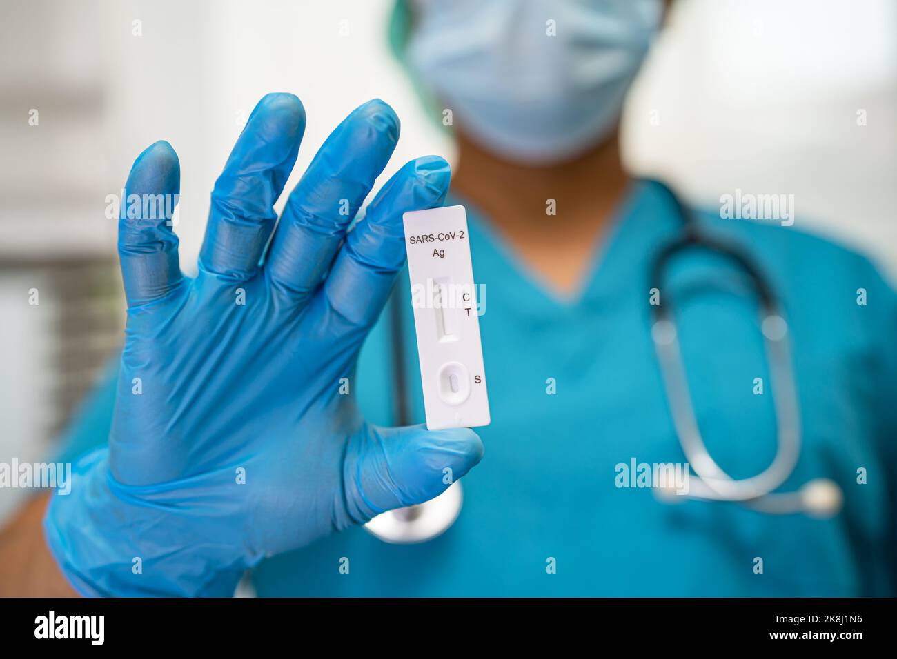 Asian doctor in PPE suit show positive test result with Saliva Antigen ...