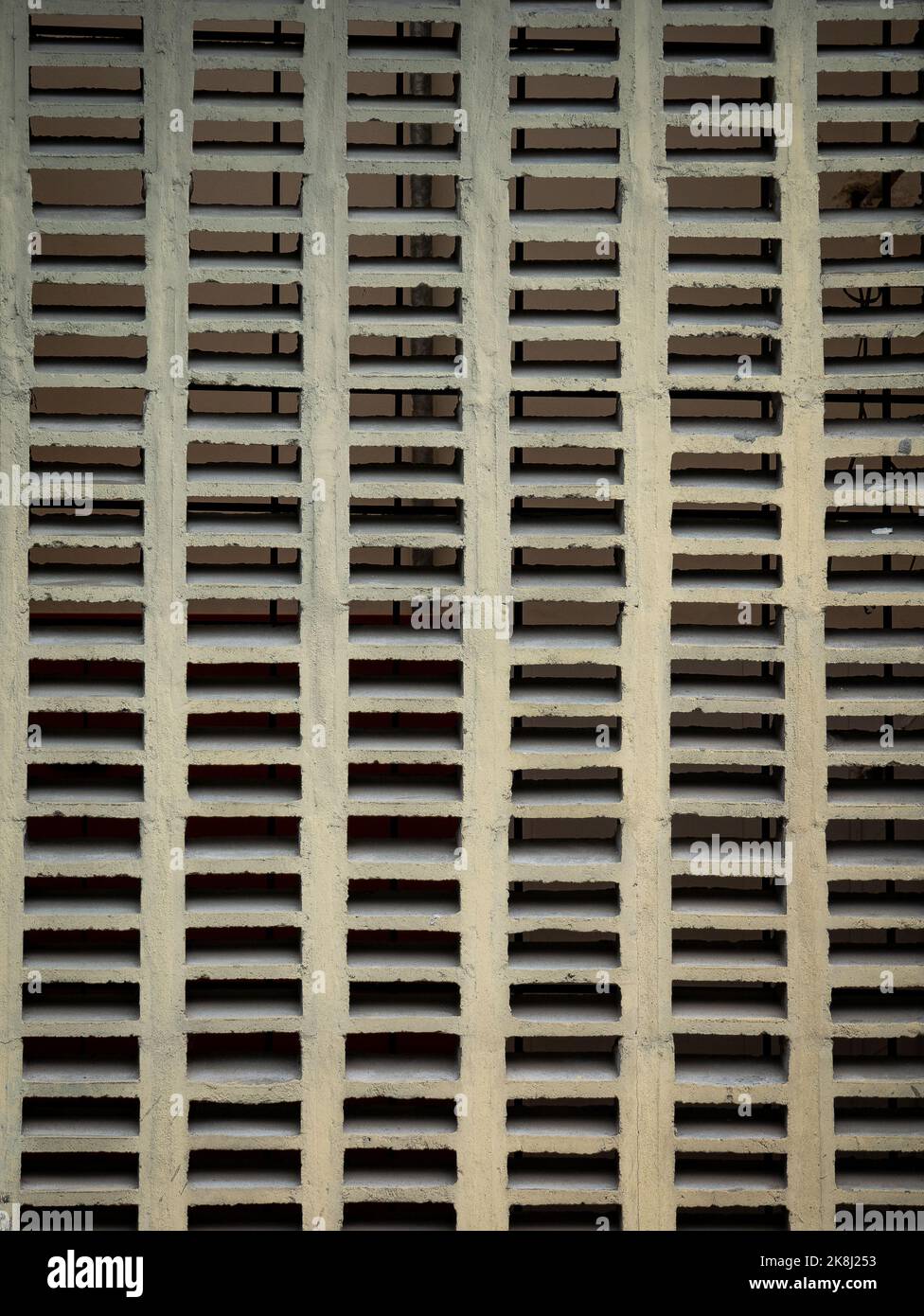 Cement Wall with Symmetrical Rectangular Holes Stock Photo - Alamy