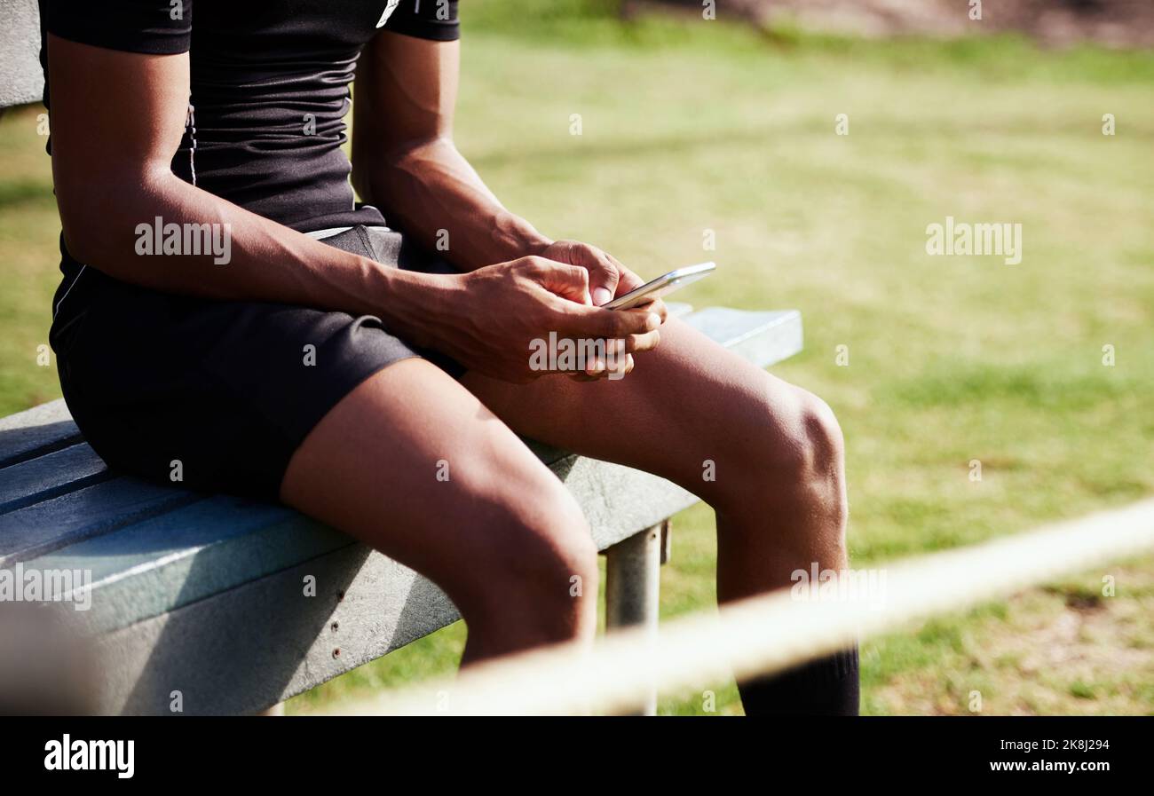 Missed the stats See them in mobile format. a man sitting on a bench ...