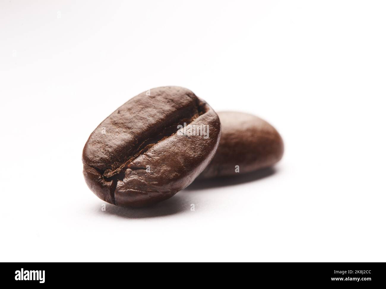 Take a break, have some coffee. Studio shot of coffee beans against a ...
