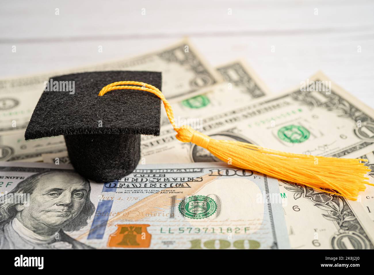 Graduation gap hat on US dollar banknotes money, Education study fee ...
