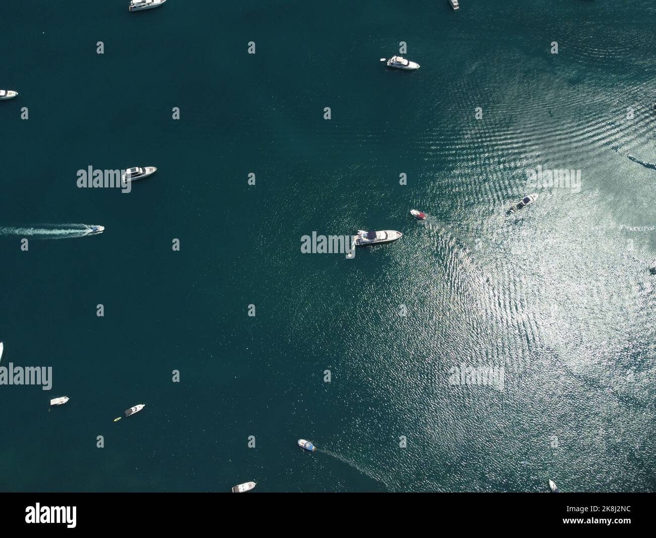 Aerial yacht on calm sea. Luxury cruise trip. View from above of white ...