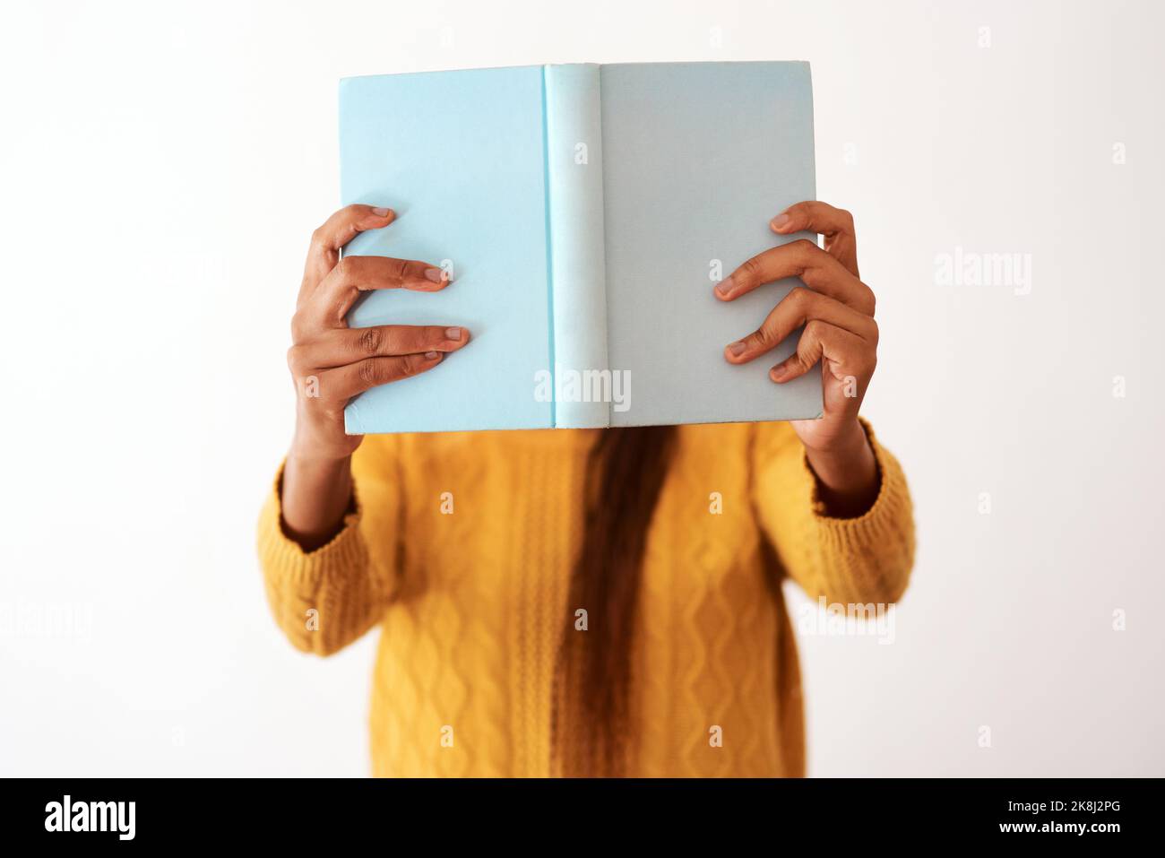 Reading is all I want to do. Studio shot of an unrecognizable woman ...
