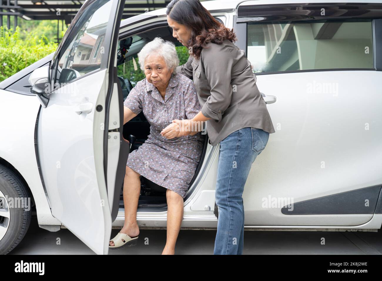 Help and support asian senior or elderly old lady woman patient sitting ...