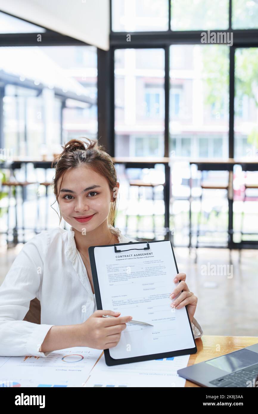 female business owner reading important documents before signing Stock ... female business owner reading important documents before signing Stock ...