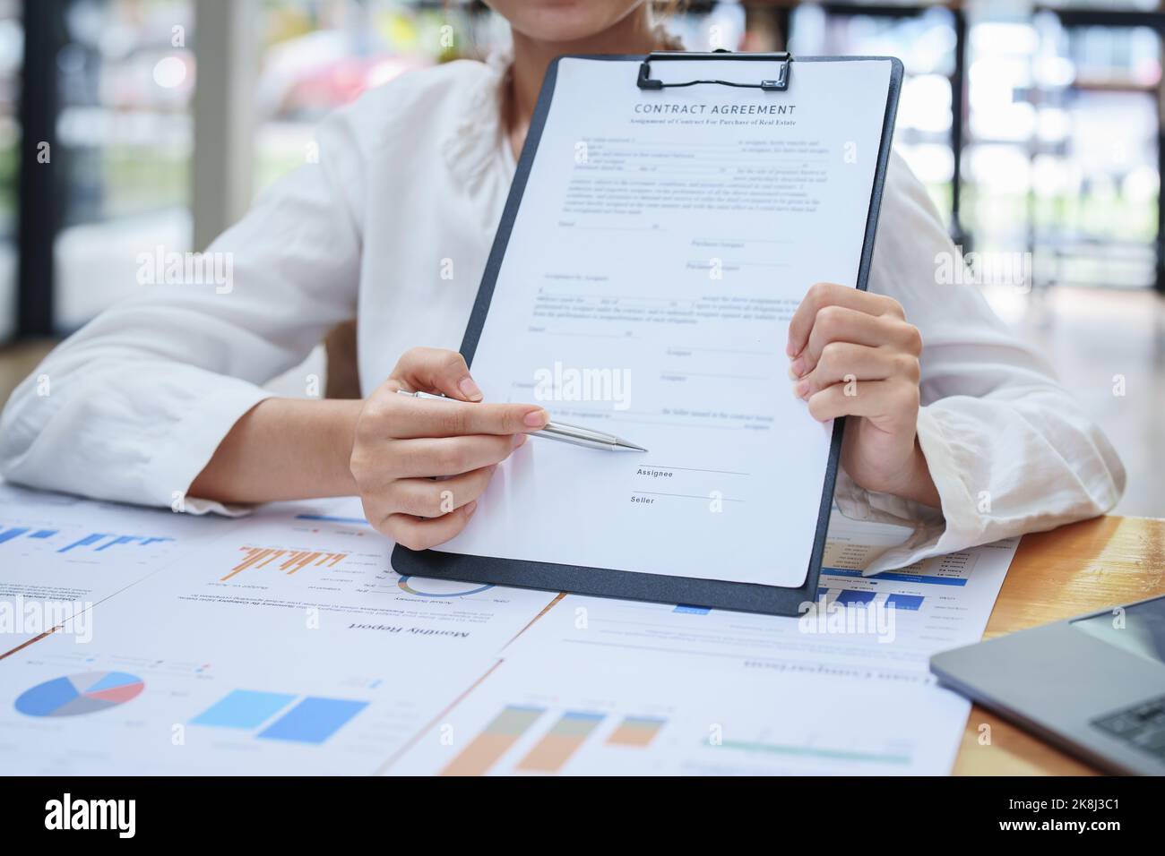 female business owner reading important documents before signing Stock ... female business owner reading important documents before signing Stock ...