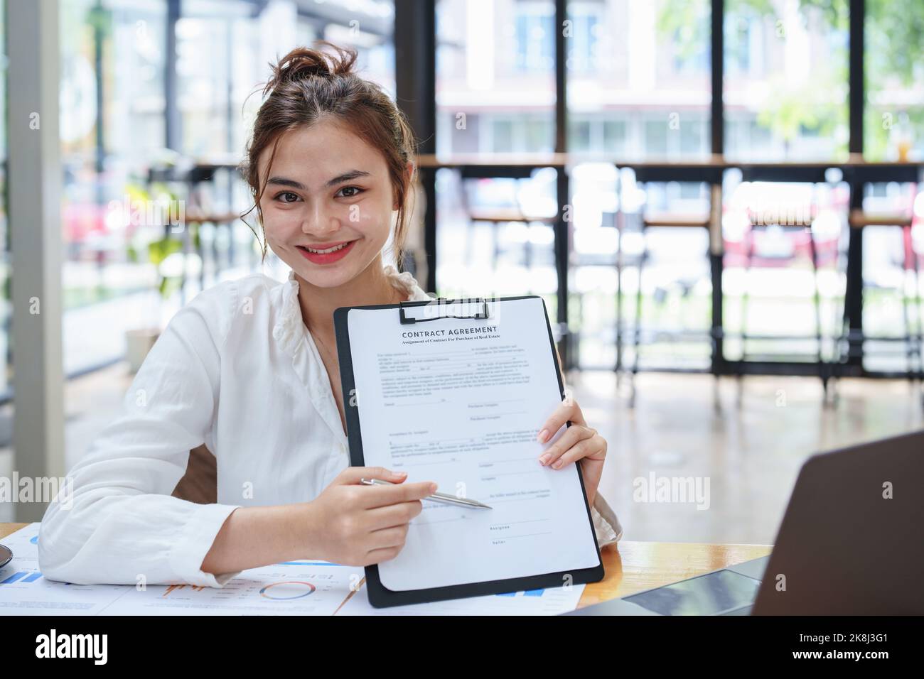 female business owner reading important documents before signing Stock ... female business owner reading important documents before signing Stock ...