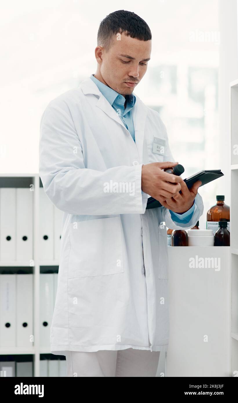The medicine that works miracles. a young scientist using a digital ...