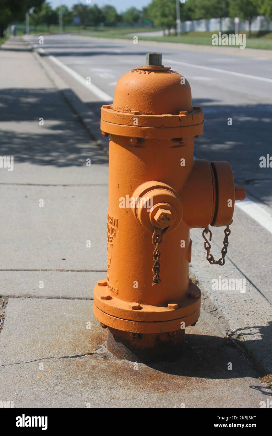 Yellow fire hydrant wide open gushing water onto the street with ...