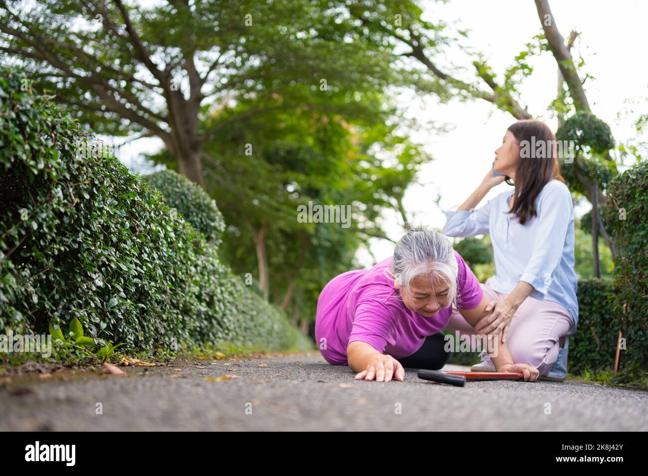 Asian senior woman fell down on lying floor because faint and limb ...