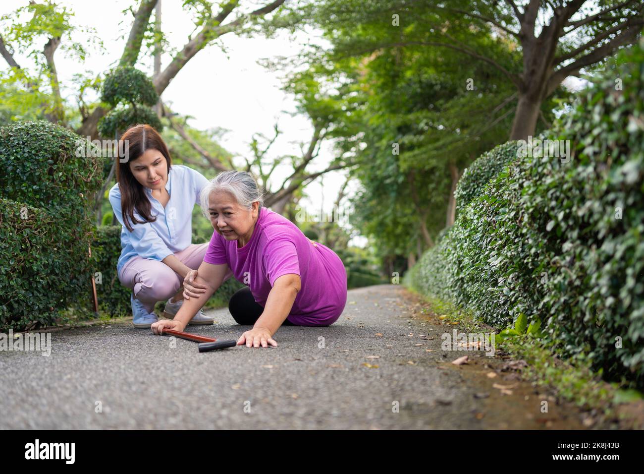 Asian senior woman fell down on lying floor because faint and limb ...