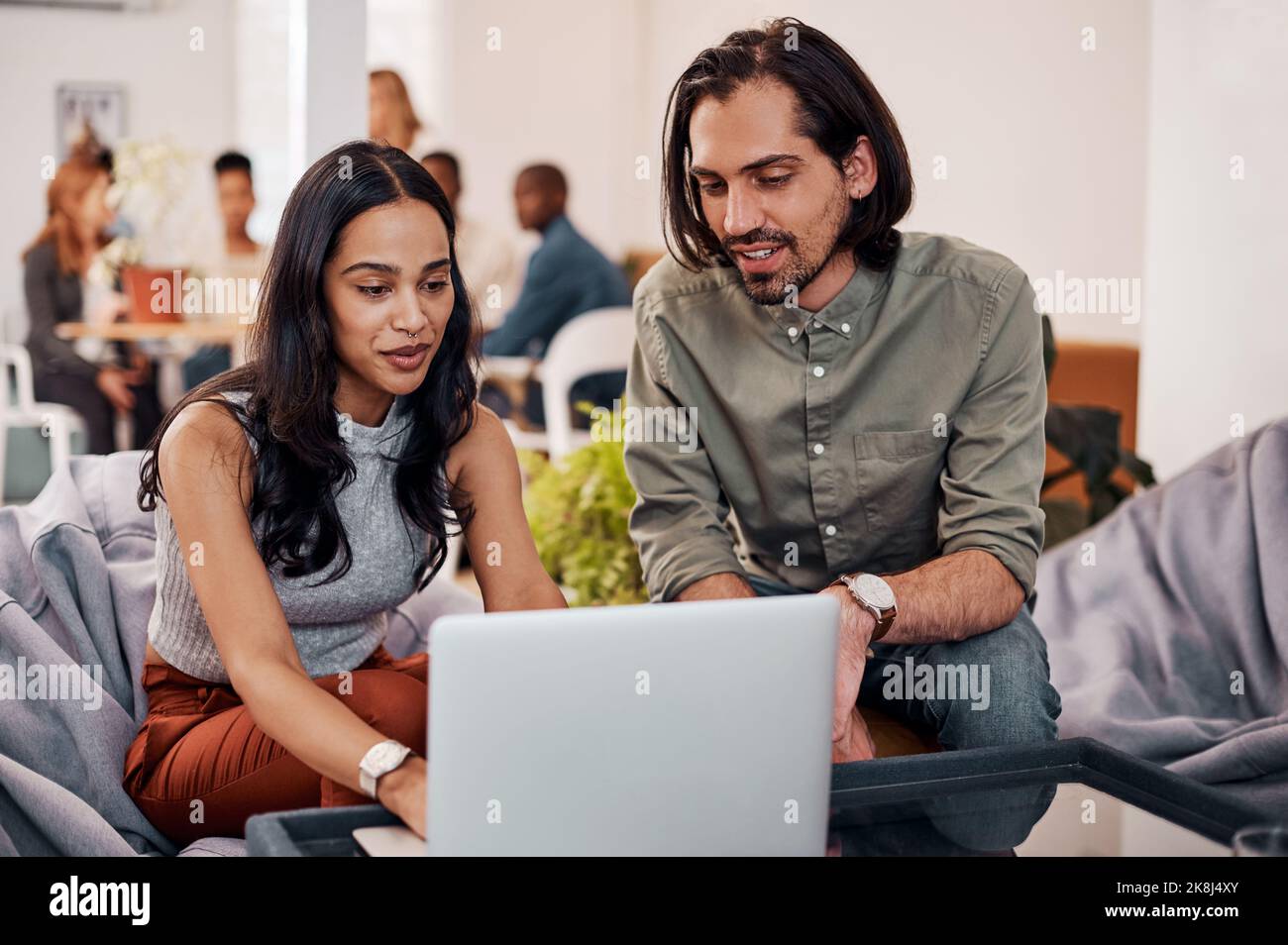 Let me show you what Ive worked on so far. two businesspeople working ...