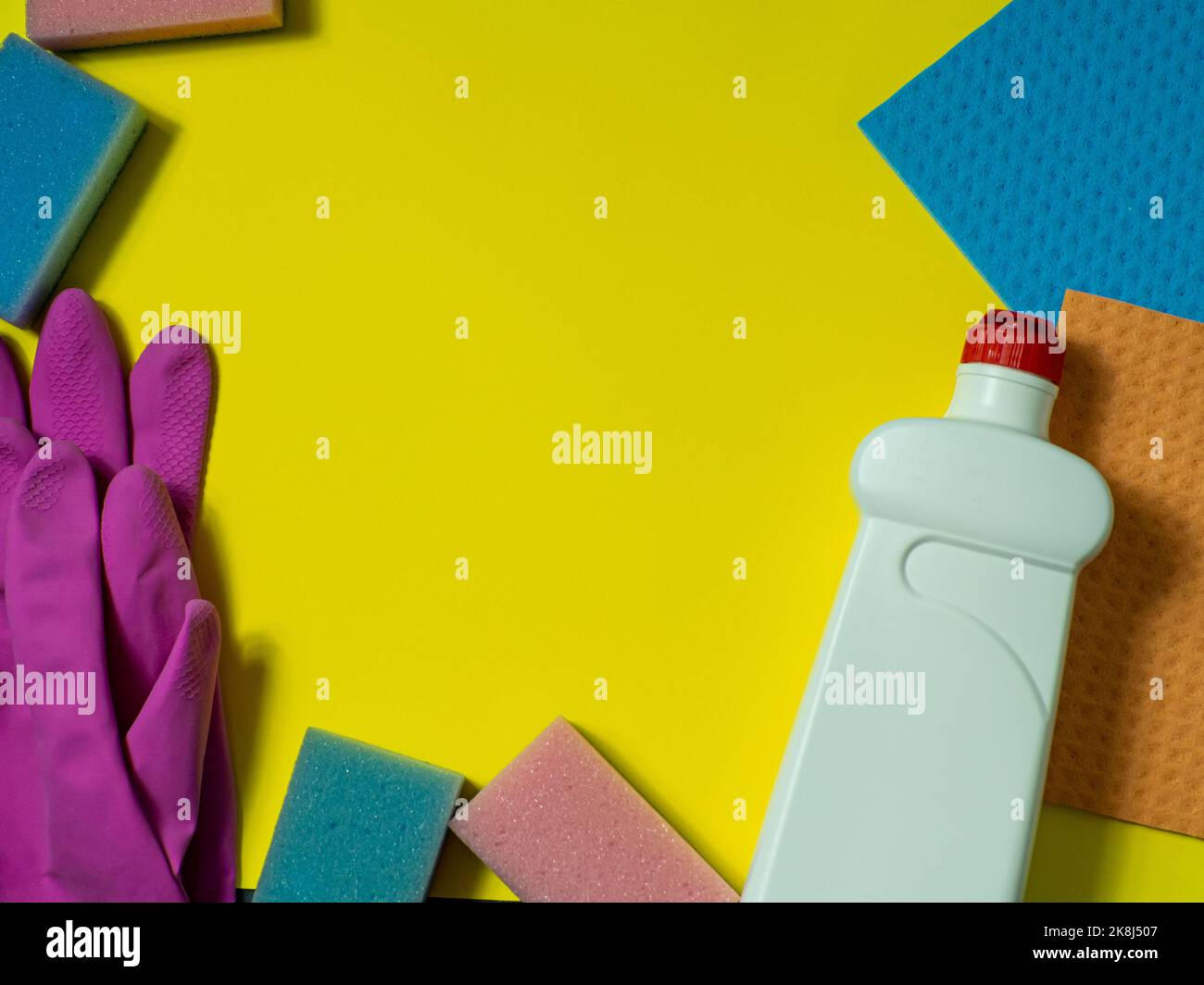 cleaning stuff on yellow background Stock Photo - Alamy