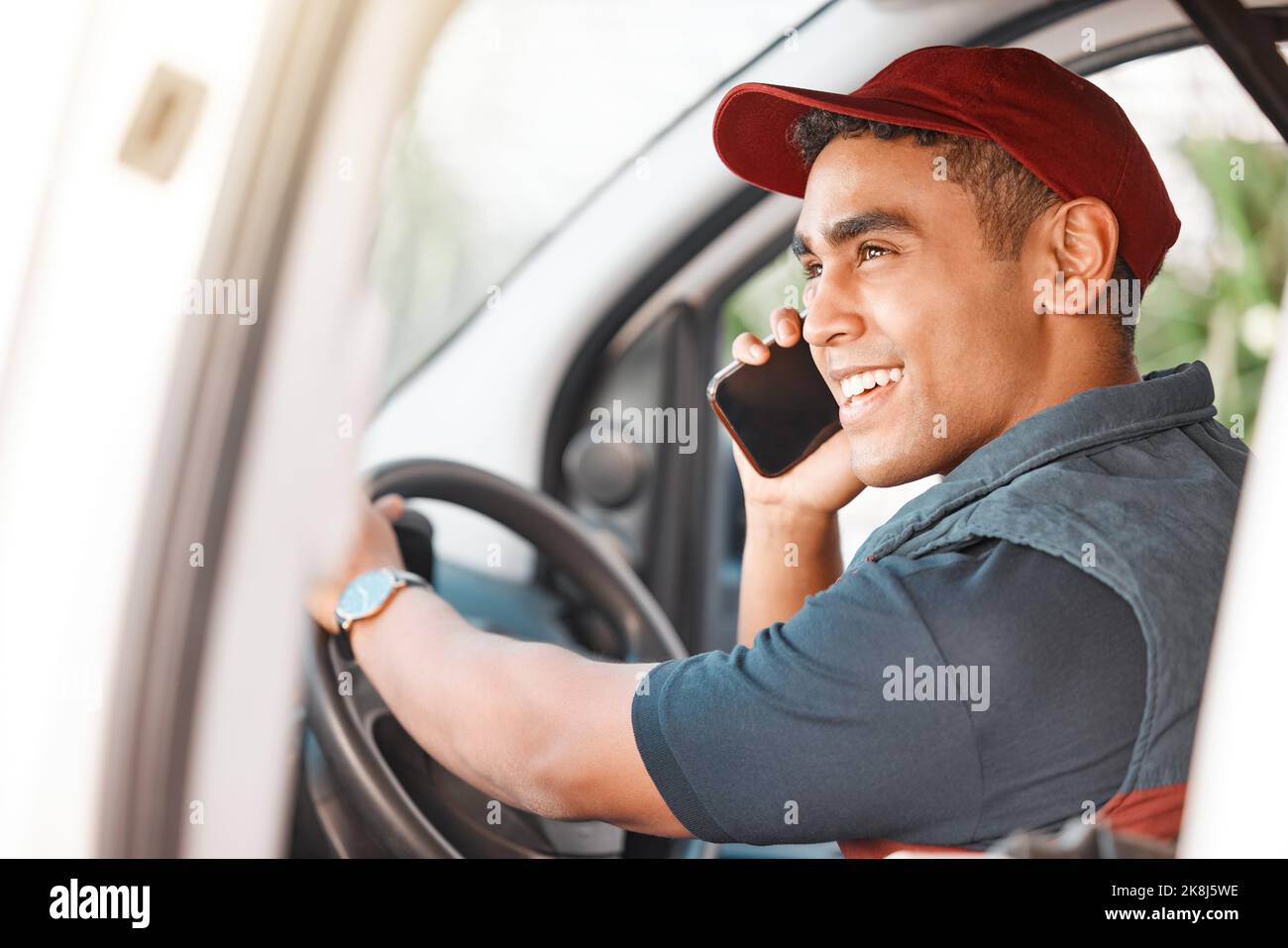 Phone call, delivery and courier talking on a mobile, working and ...