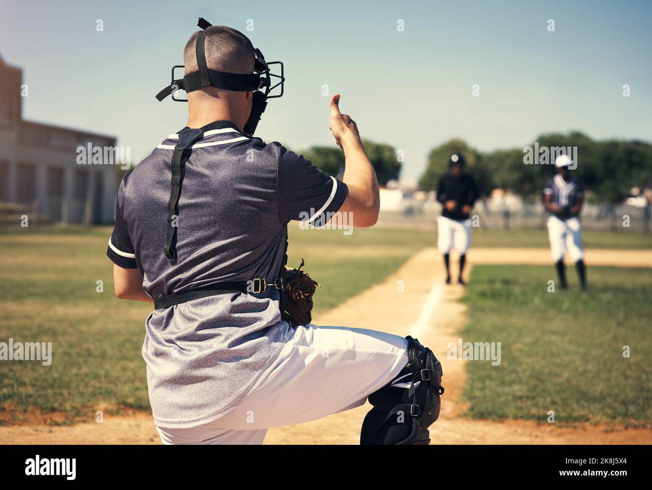 The only way to win is to start. Rearview shot of a young man giving ...