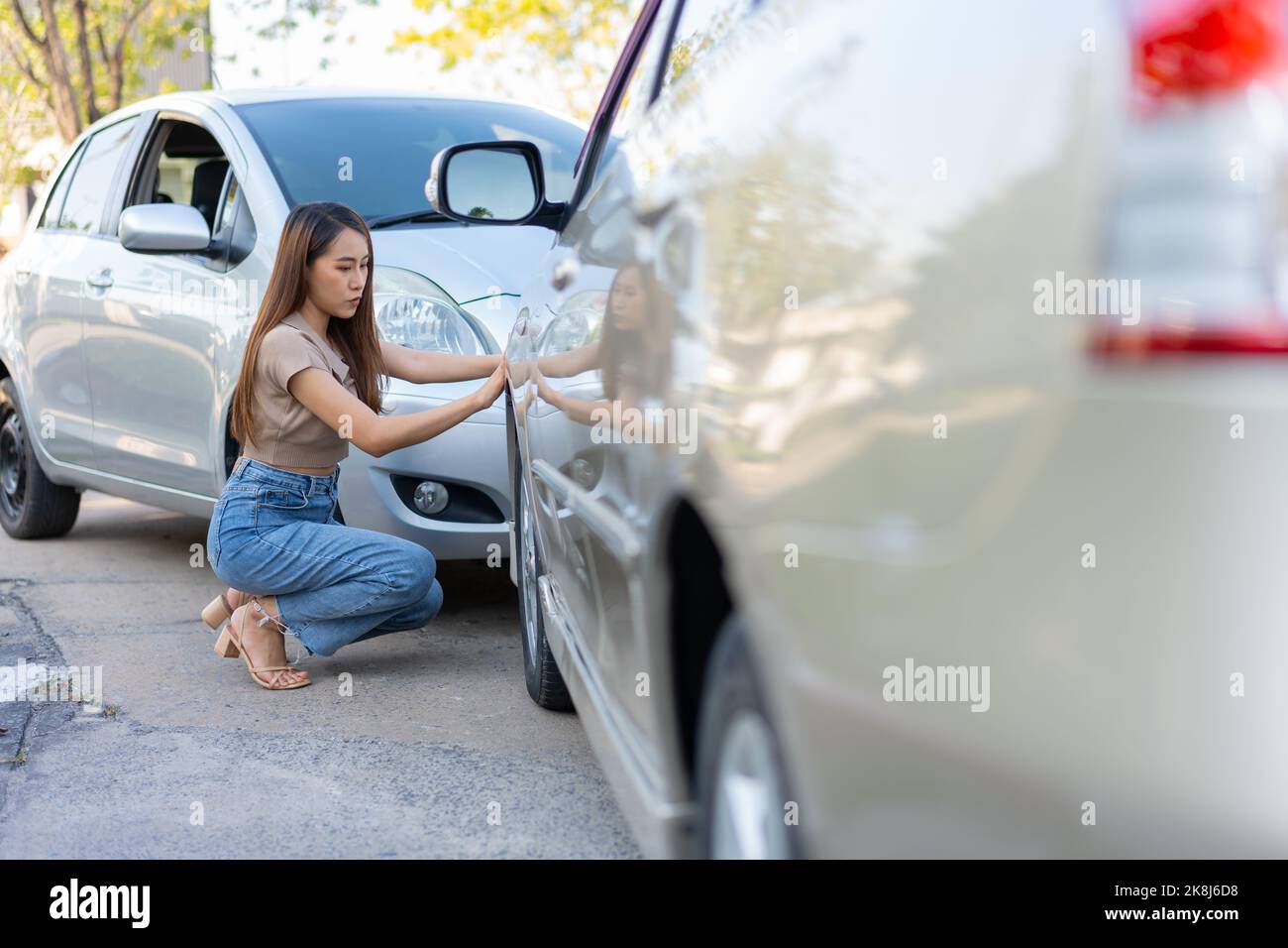 Women drivers sad after a car accident because not have car accident ...