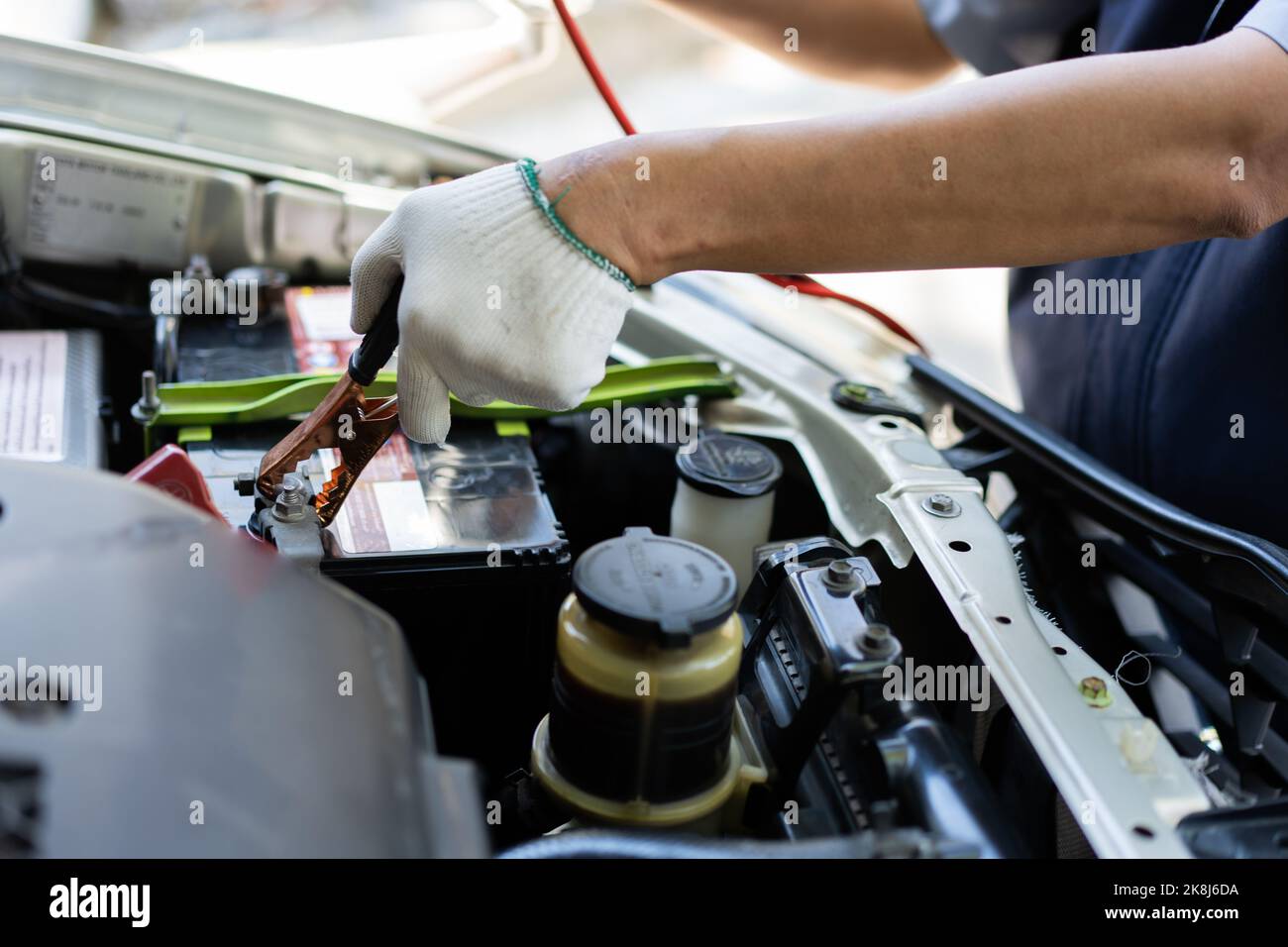 Close up and Selective focus of car mechanic holding battery ...