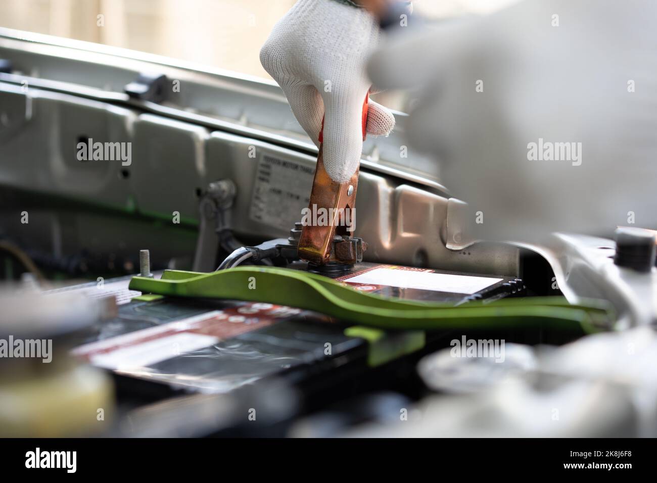 Close up and Selective focus of car mechanic holding battery ...