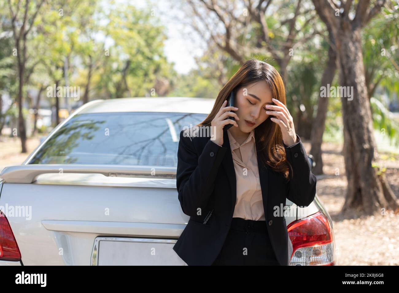 Woman drivers call insurance after a car accident before taking ...