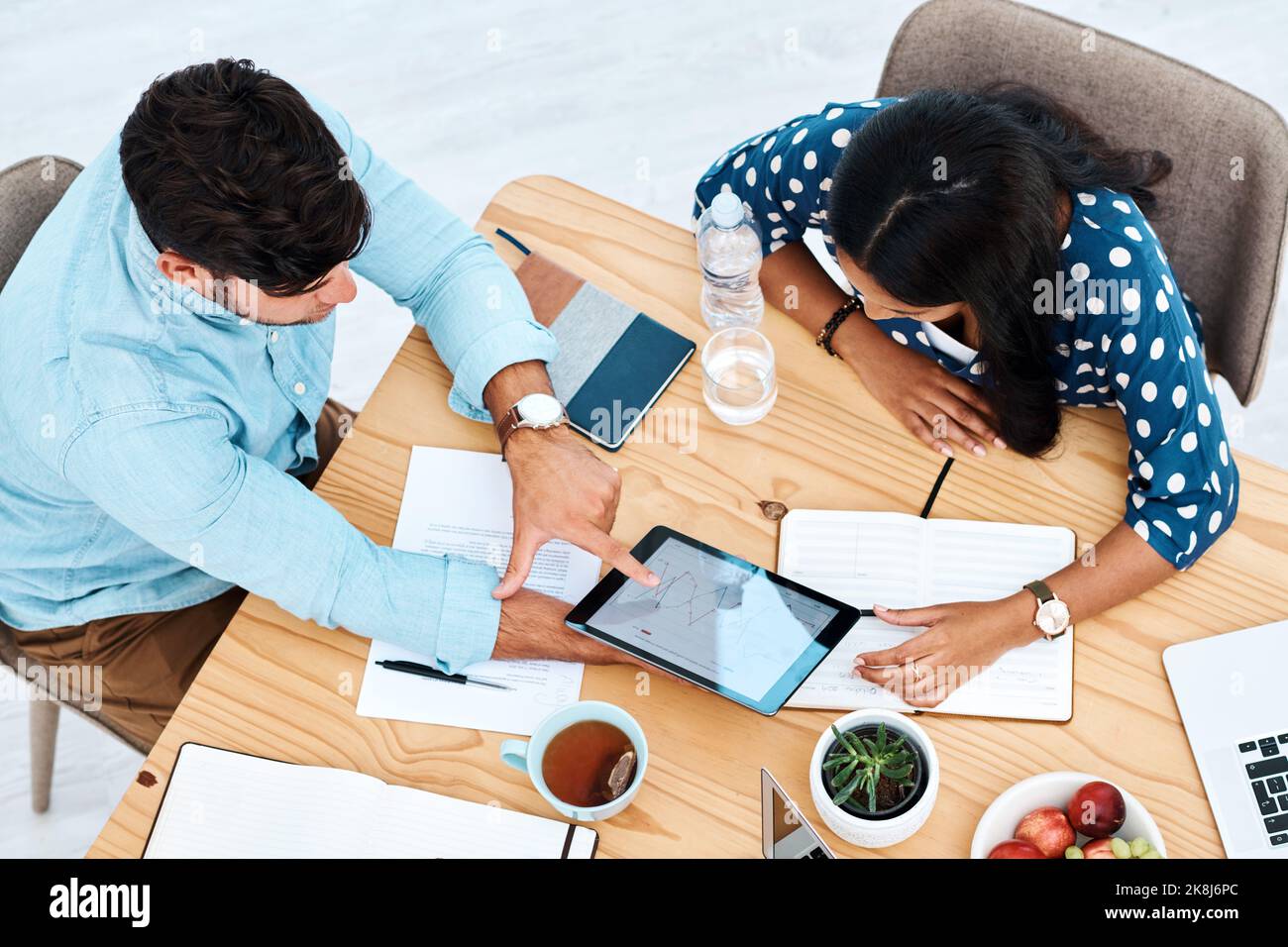 Turning their attention to the latest stats. High angle shot of two ...