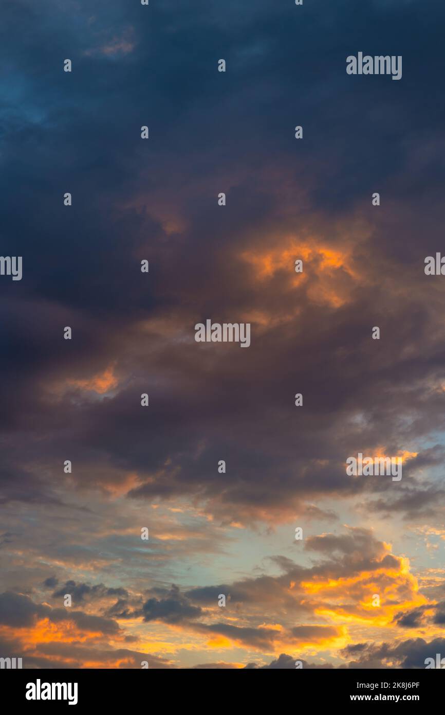 Dramatic clouds at sunrise. Partly cloudy sky vertical background photo ...