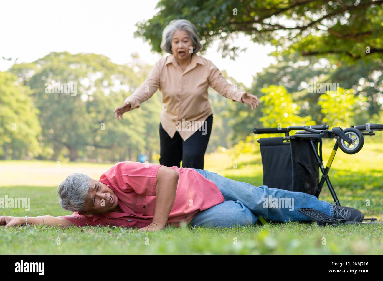 Asian senior man falling down from wheelchair on lying floor after ...