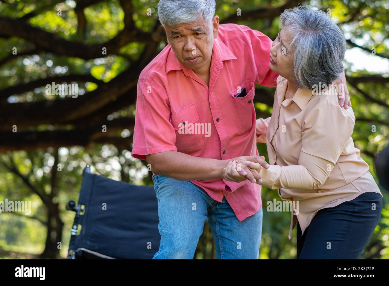 Asian senior man falling down on lying floor at park after Stumbled and ...