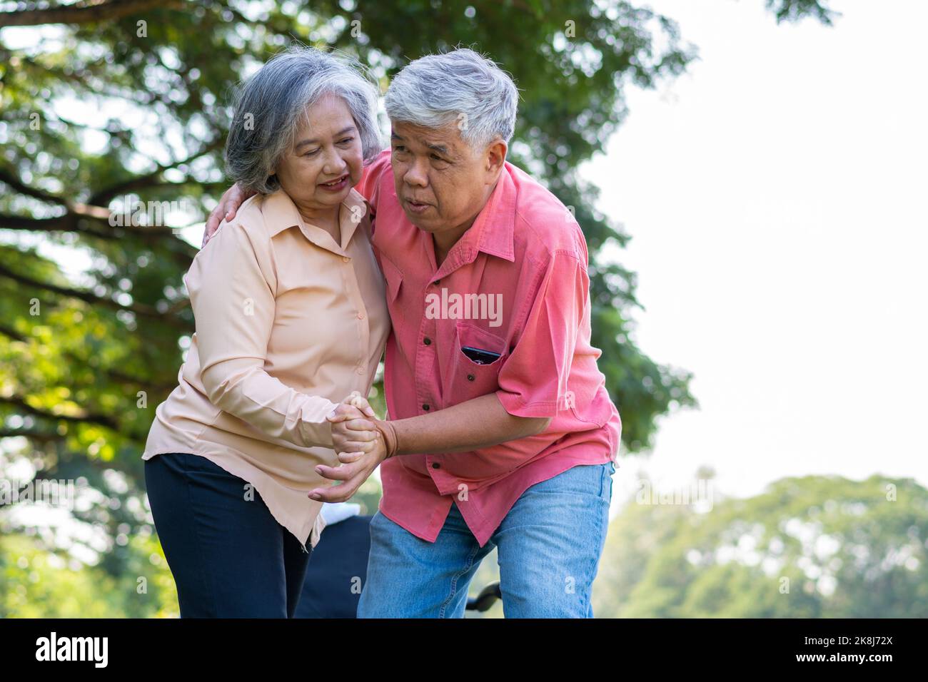 Asian senior man falling down on lying floor at park after Stumbled and ...